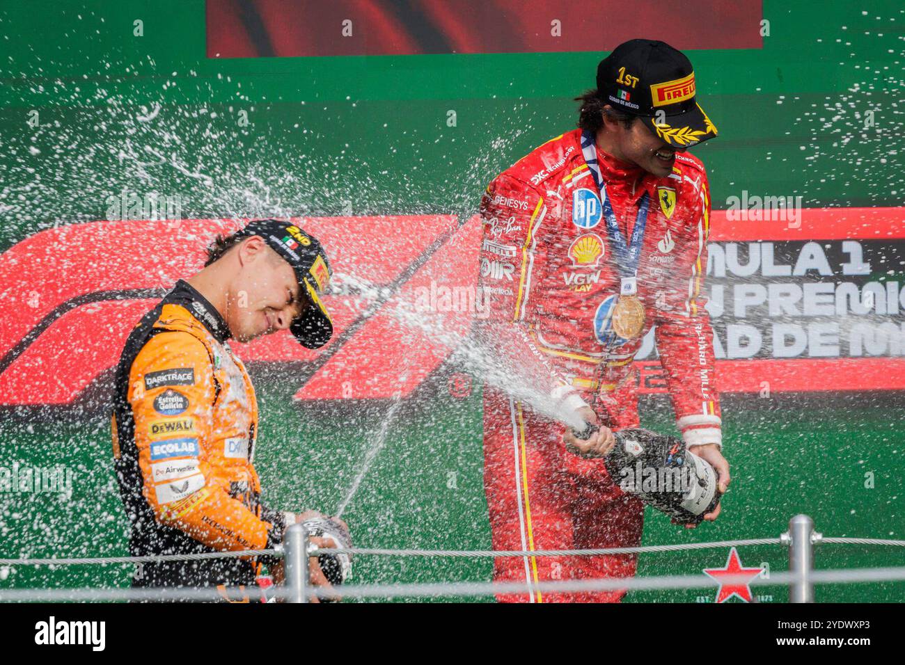 Race winner Carlos Sainz of Spain and Scuderia Ferrari HP (L) and ...