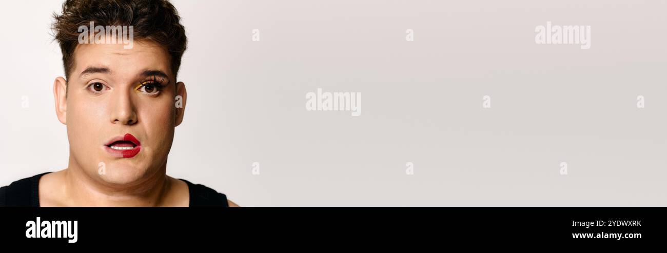 An expressive individual displays bold makeup and unique style in a ...