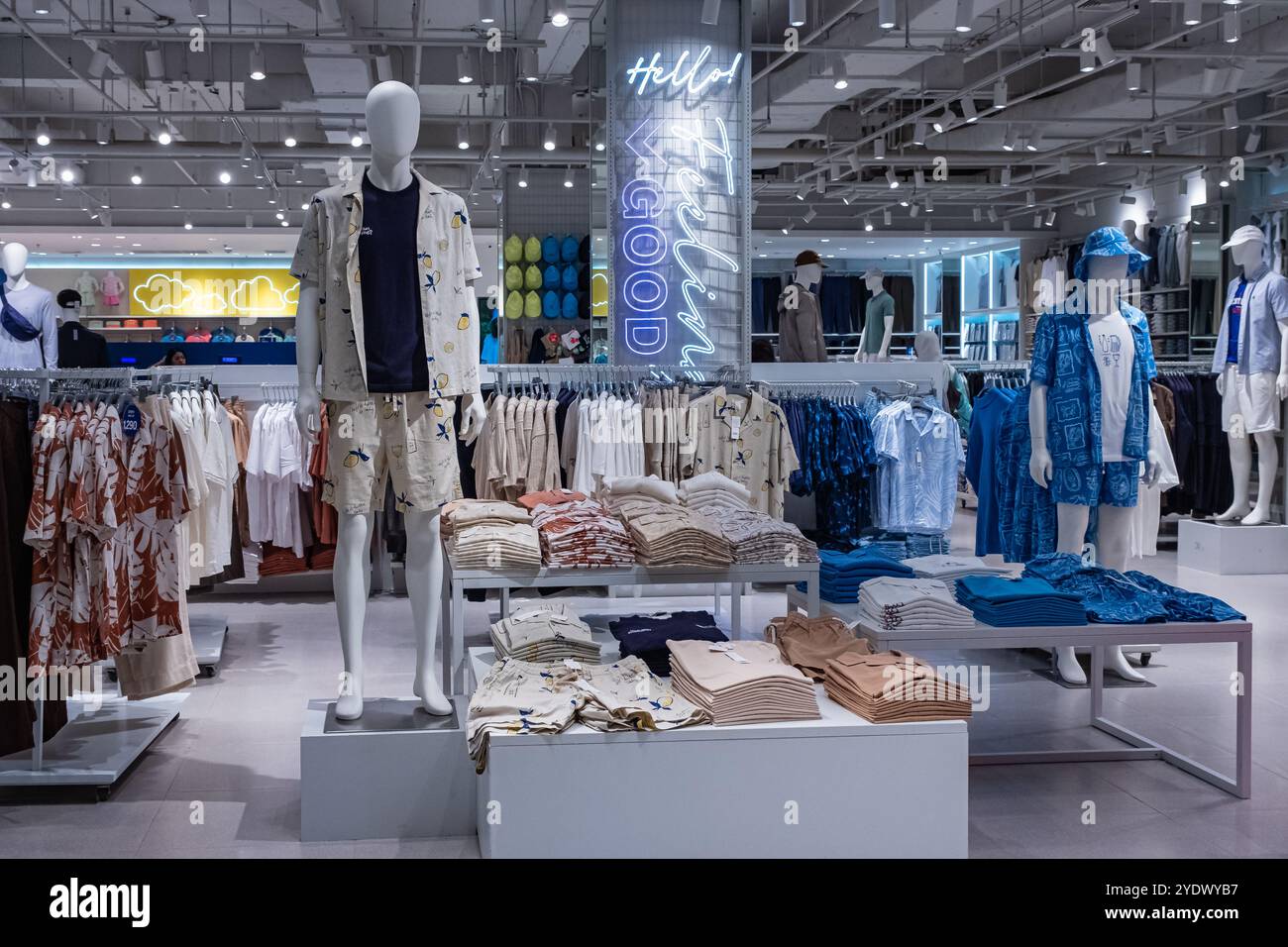 Modern retail store with a variety of clothing, accessories displayed ...