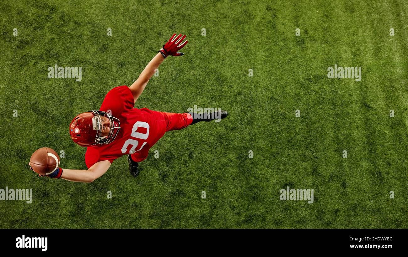 Top view image of concentrated man, American football player in red ...