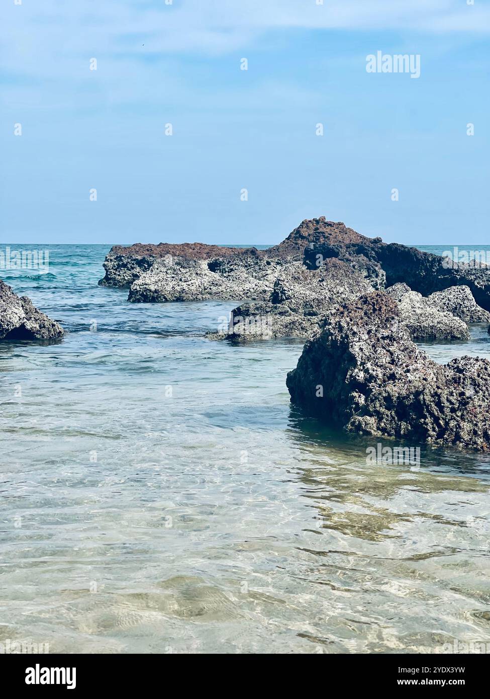 Beautiful image of a Senegalese beach, featuring rocks, sand, and clear ...