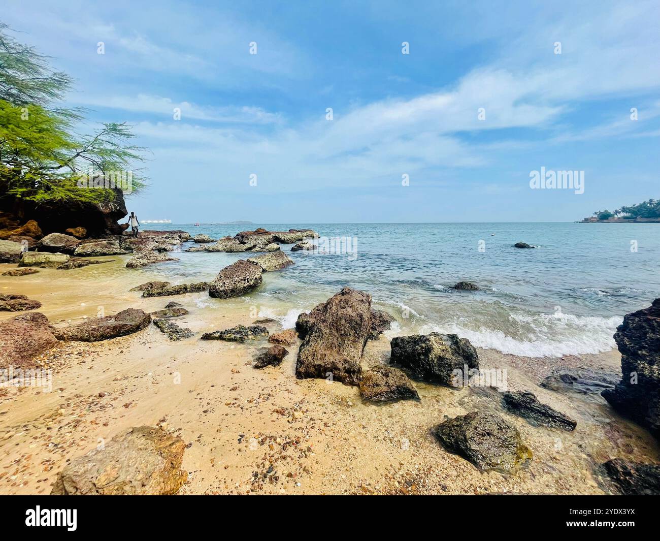 Beautiful image of a Senegalese beach, featuring rocks, sand, and clear ...