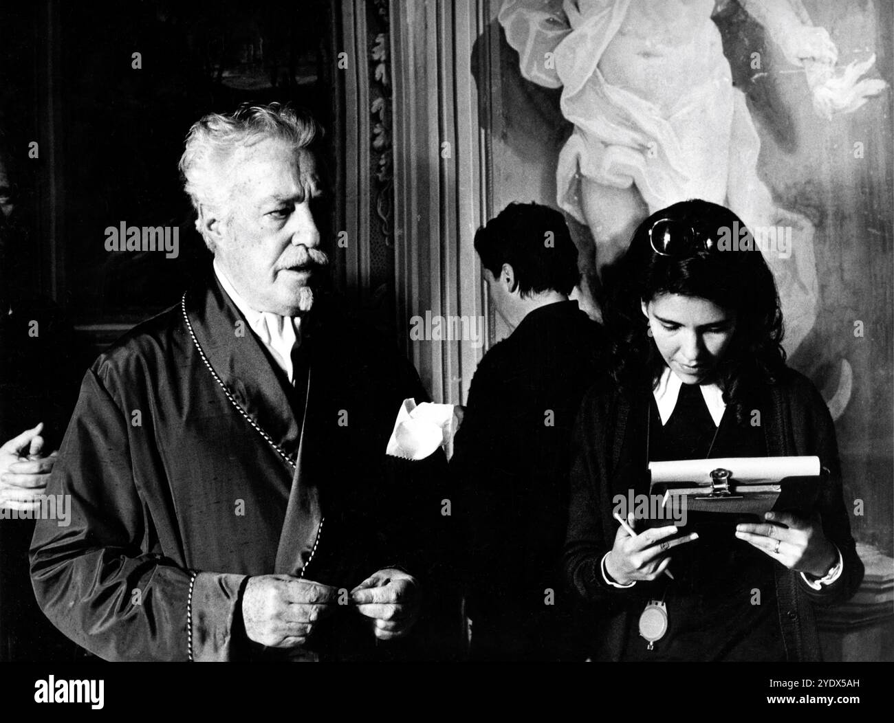 VITTORIO DE SICA on set candid going over his lines with Script Girl ...