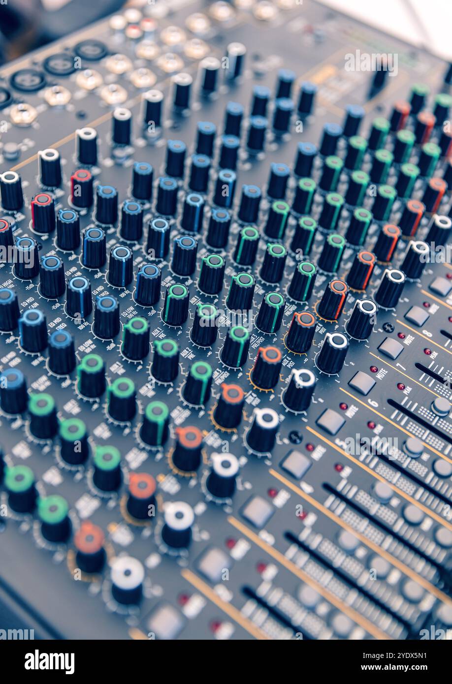 Professional audio mixer with faders and knobs for sound engineering ...