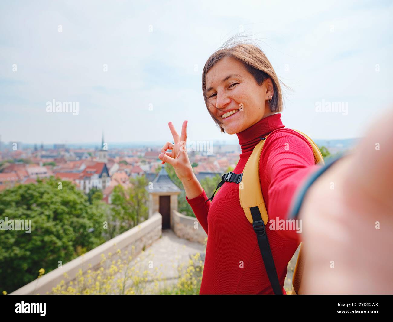 Tourist woman explores beautiful city of Erfurt, wandering through its ...