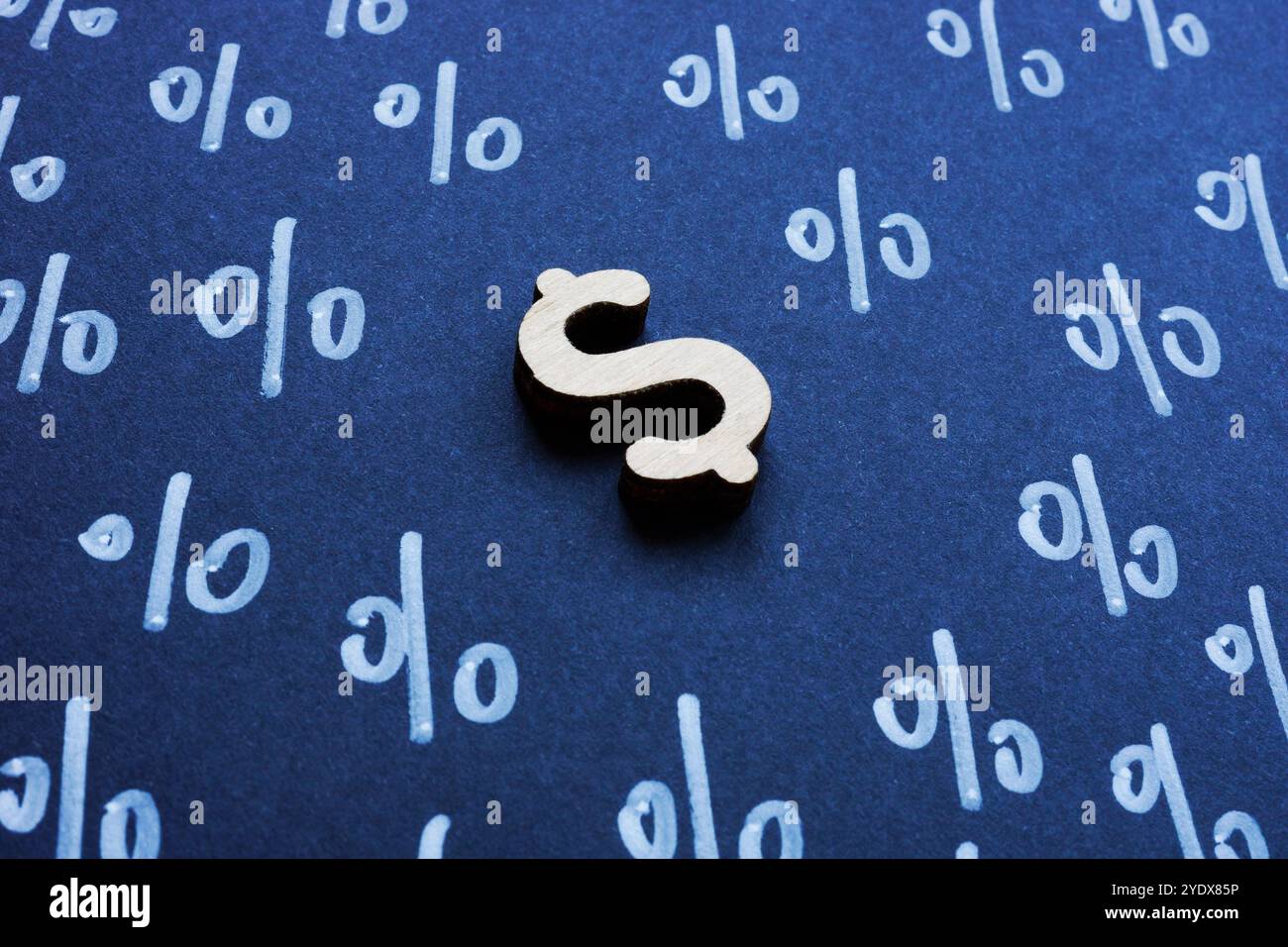 Dollar sign surrounded by percentage symbols. Interest rates and ...