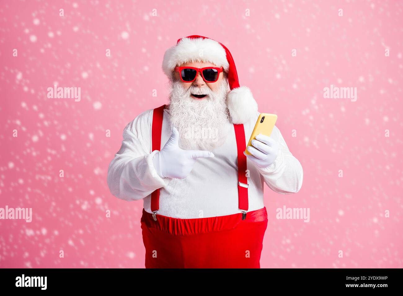Portrait of his he nice attractive cheerful bearded fat guy Santa using ...
