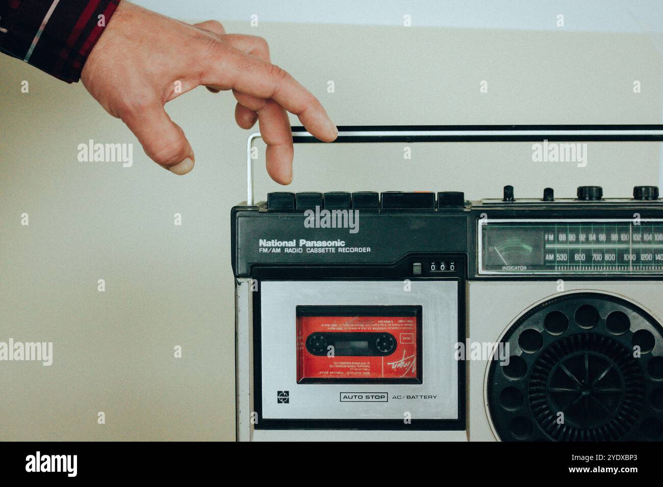Madrid, Spain. May 2, 2023 A man put music cassette into an old record ...