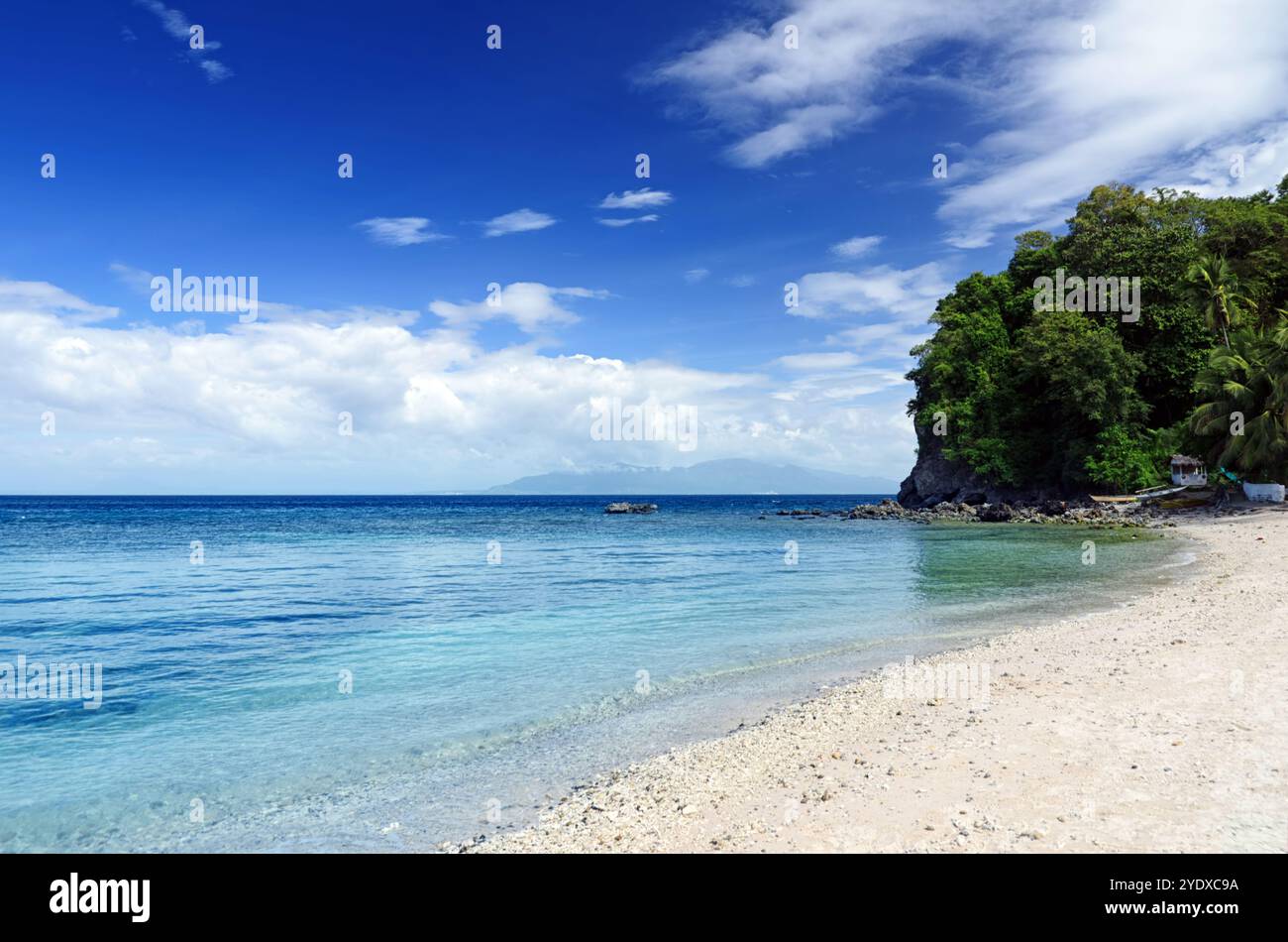 Blue sky and clear water. The White Beach, Puerta Galera, Philippines ...