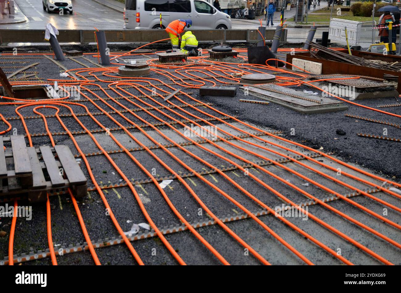 Installing under street heating in the Norwegian town of Tromso, north ...