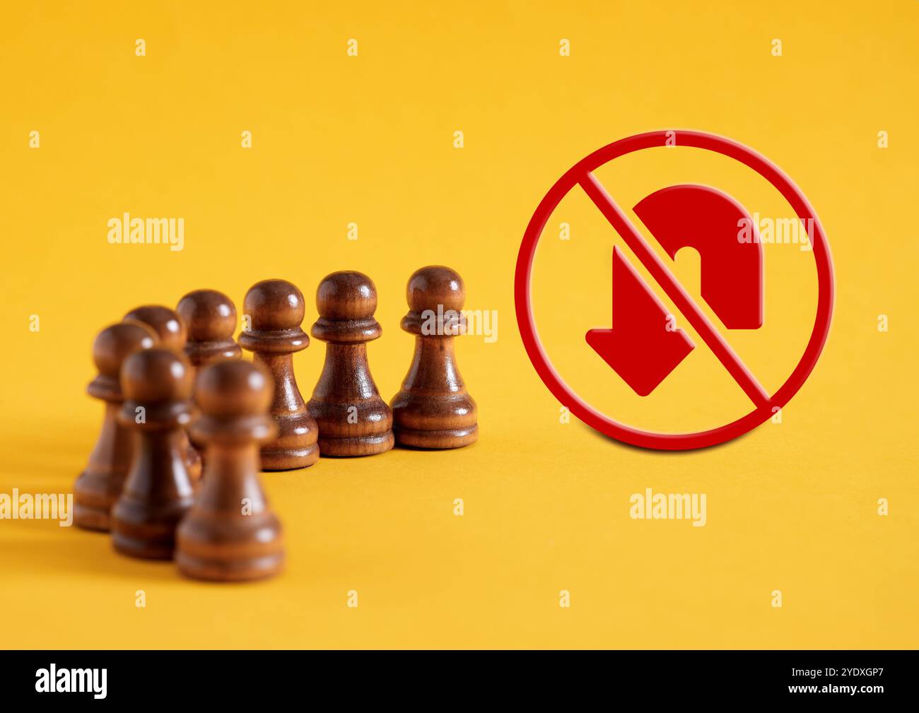 Chess pawns in a queue next to no turning back sign. Determination ...