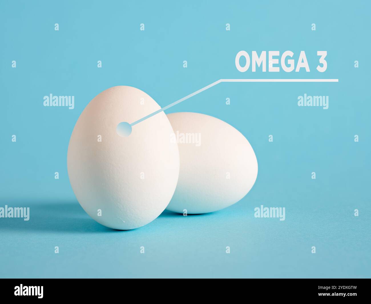 White eggs with Omega 3 label on blue background. Healthy nutrition and ...
