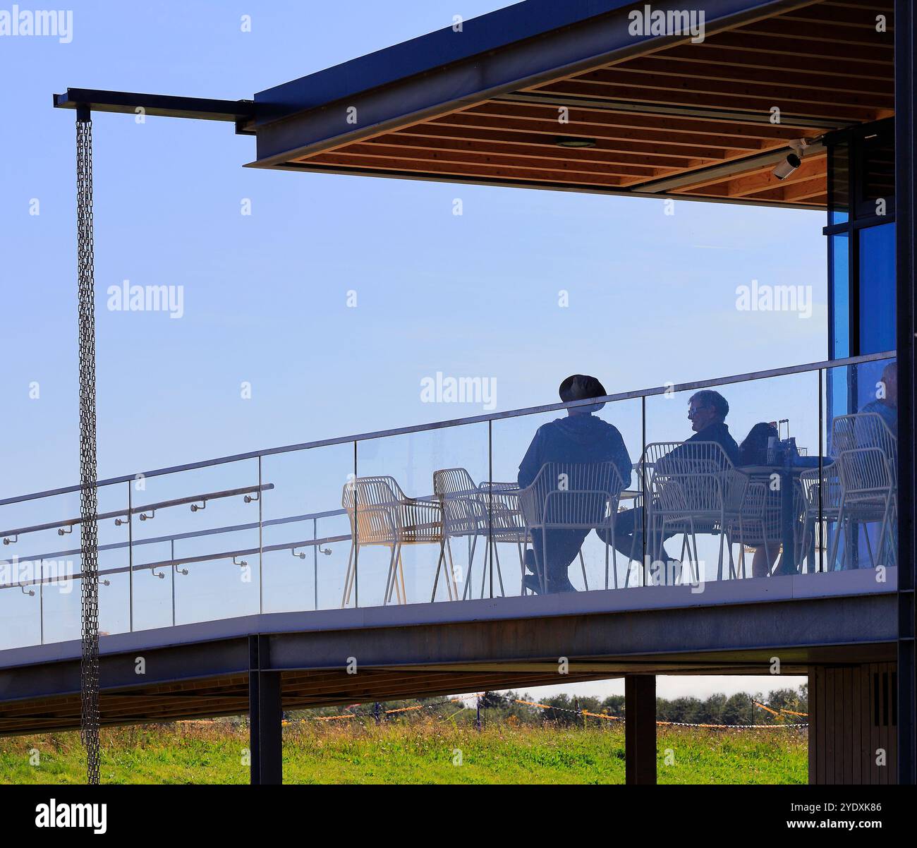 Two men enjoy the view and a chat at the Visitor centre and cafe ...