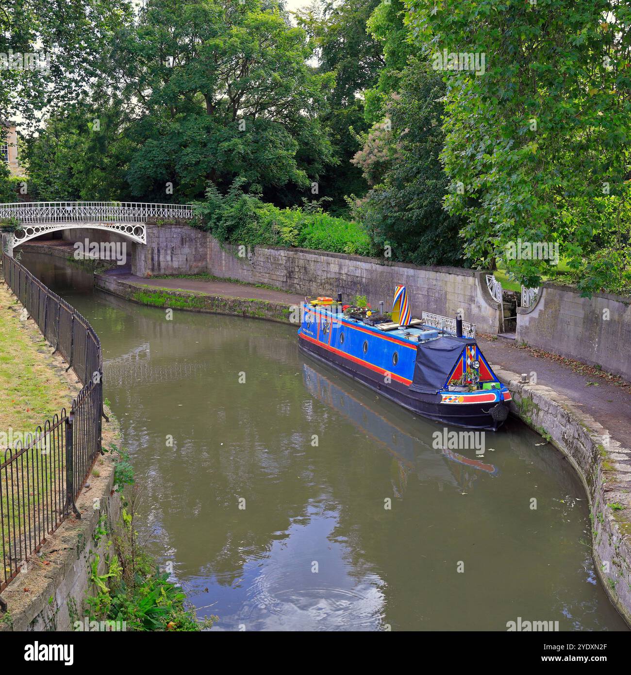 Colourful narrowboat moored on the banks of the Kennet and Avon Canal ...