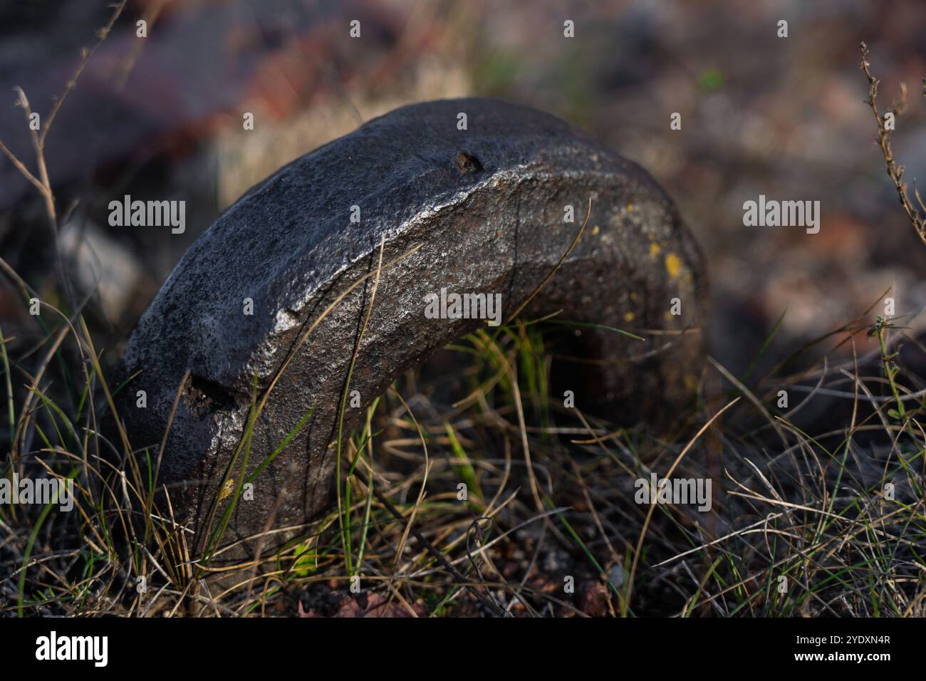 An old, thick, rusty hook sticks out of a brick fortress Stock Photo ...