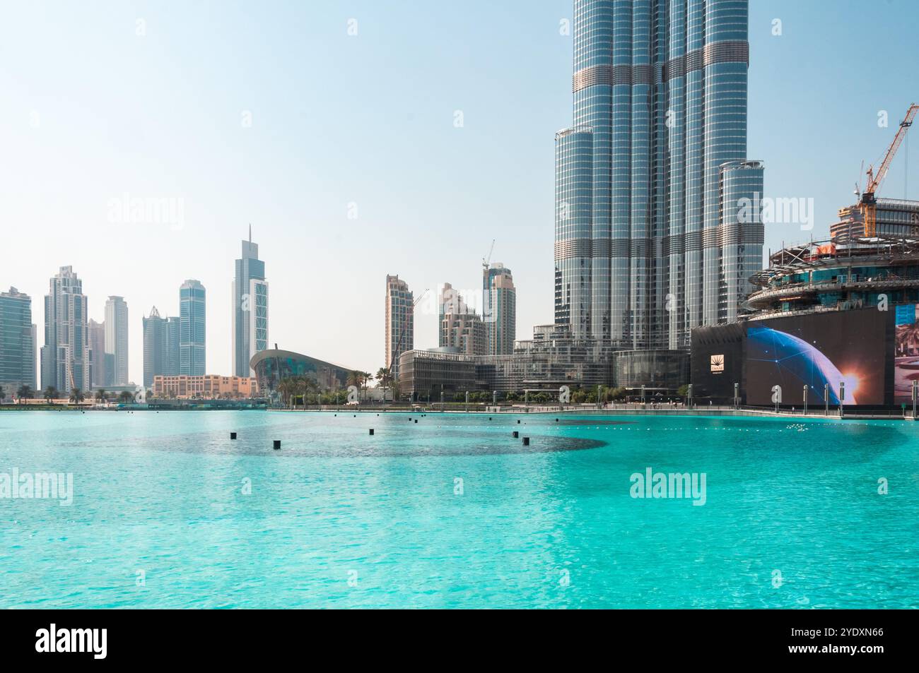 Dubai, UAE - October 17, 2016: Modern skyscrapers and a large turquoise ...