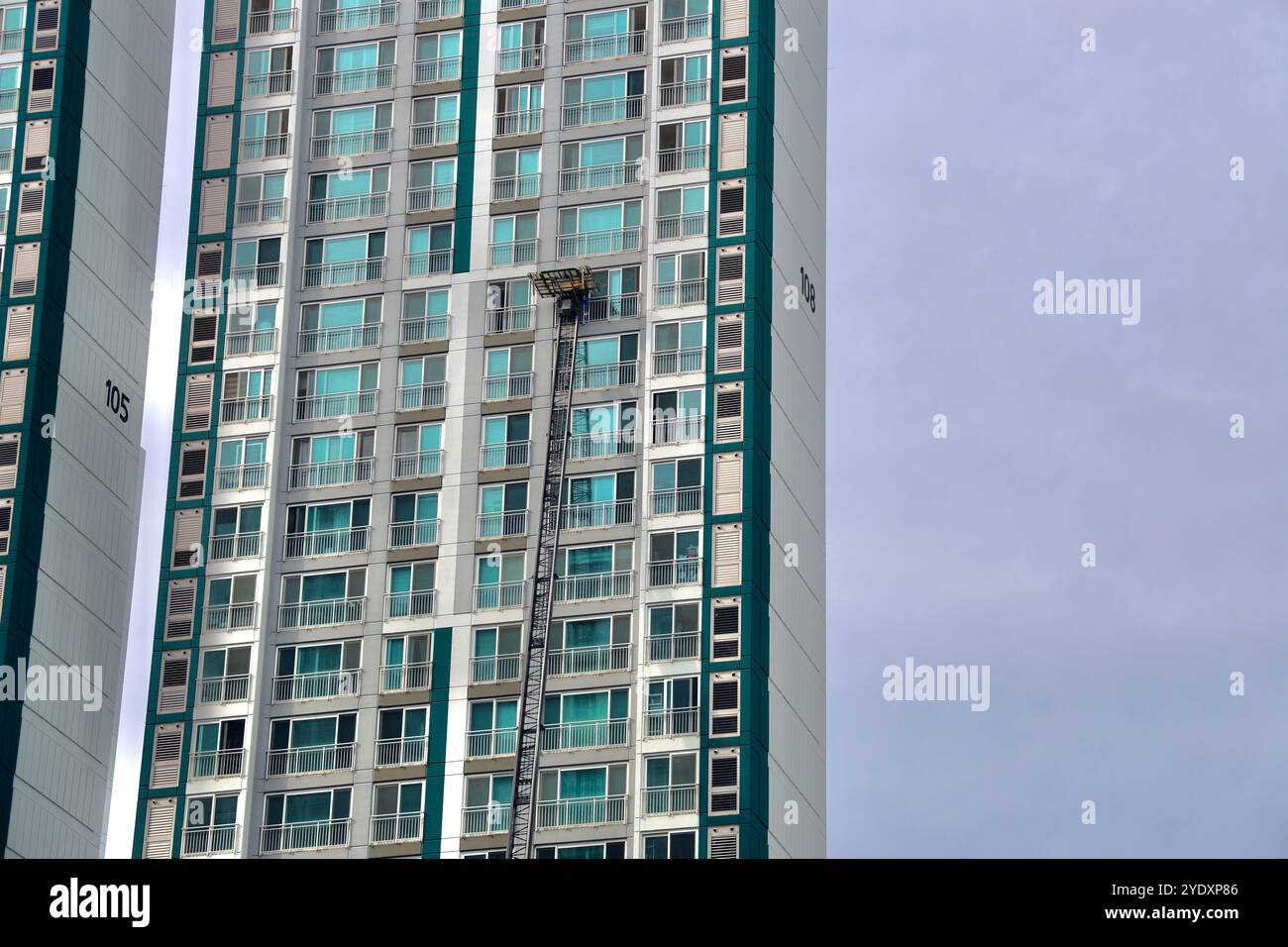 Ulsan, South Korea - October 27, 2024: A moving ladder truck extends up ...