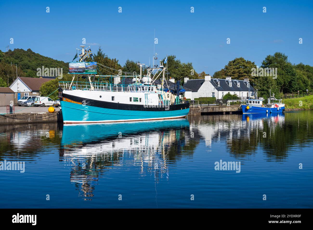 Boats moored in Corpach Basin, entrance to the Caledonian Canal, at ...