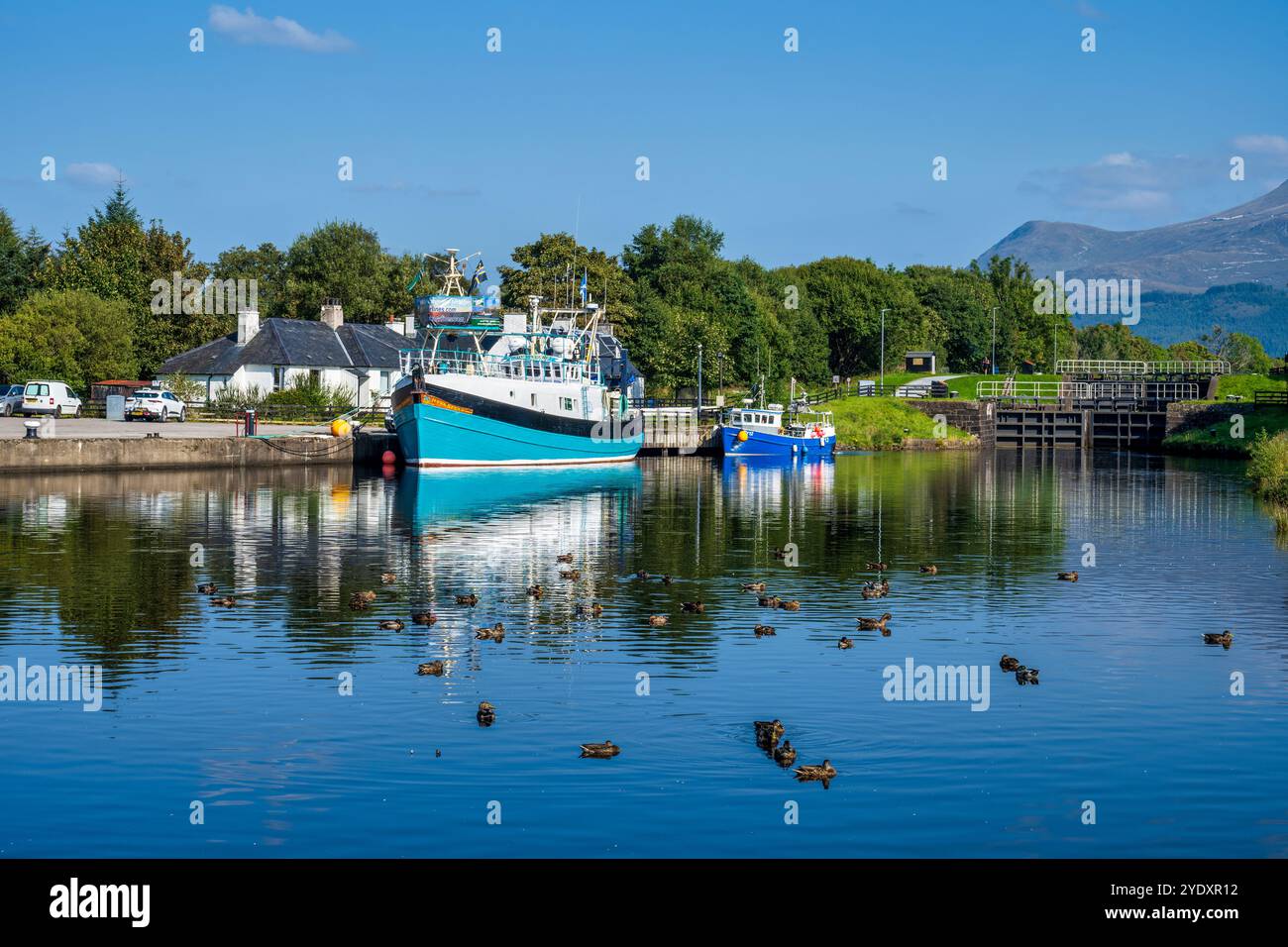 Boats in Corpach Basin, entrance to Caledonian Canal, with Ben Nevis ...