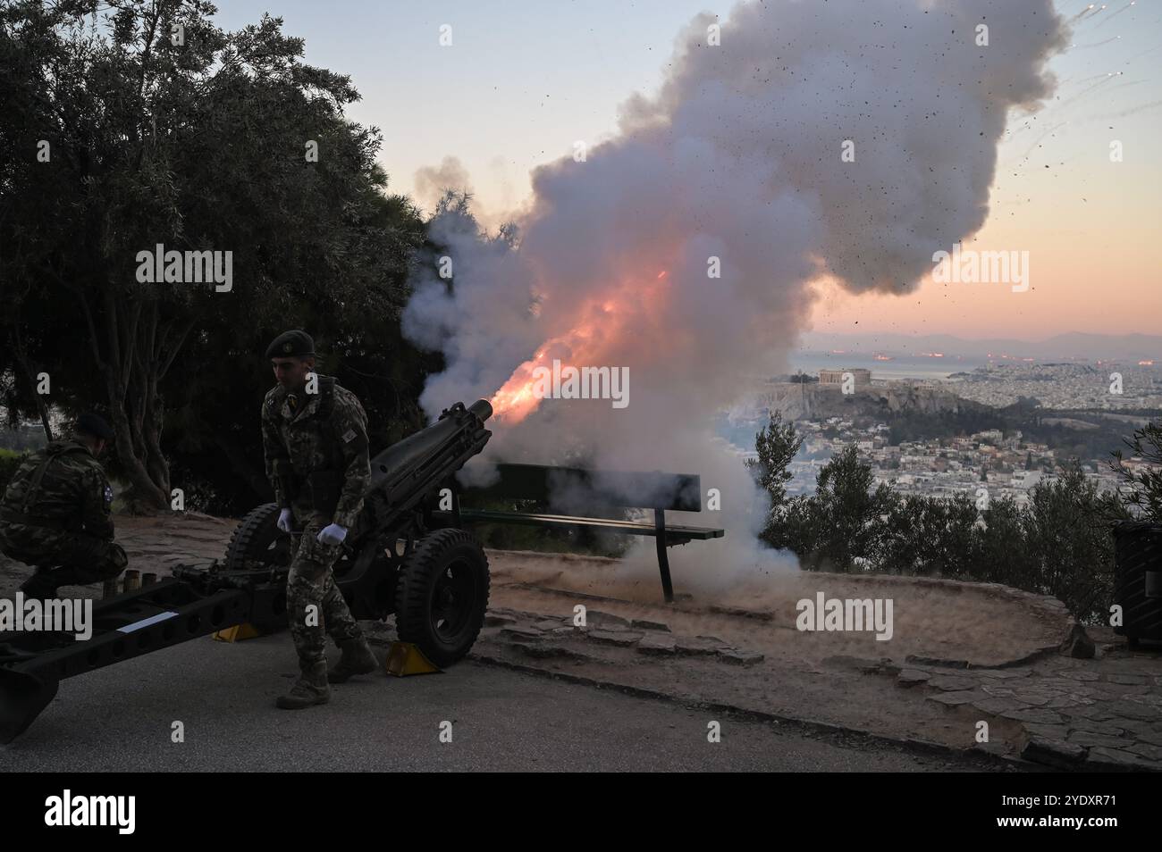 Athens, Greece. 28th Oct, 2024. Greek soldiers fire a cannon over the ...