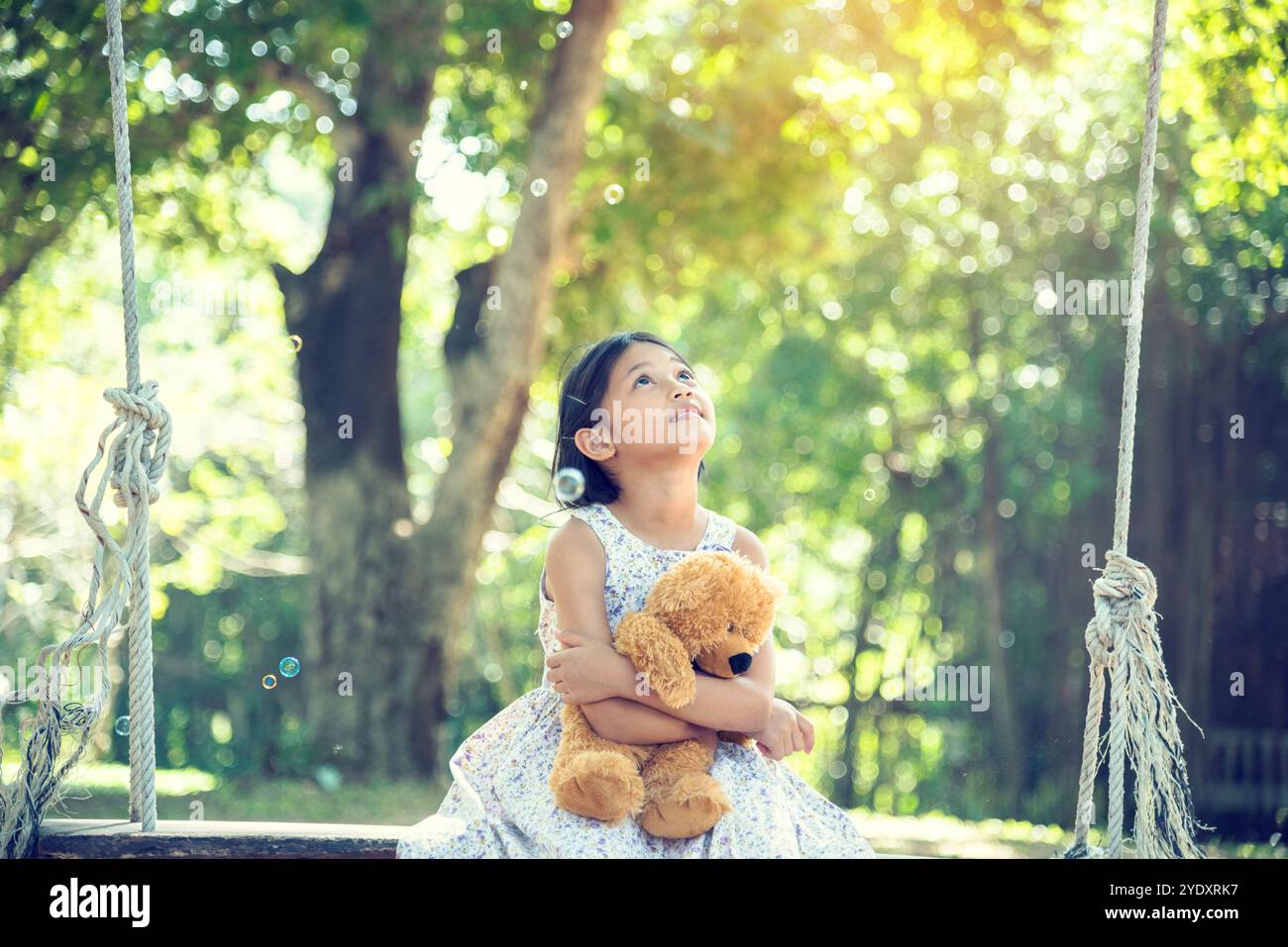 Happy Child hug teddy bear in green park playground. Teddy bear best ...