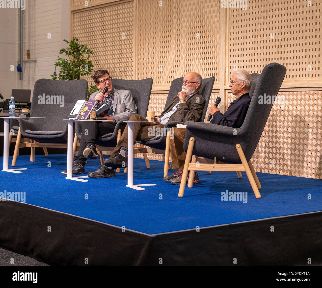 Henrik Huldén talking with authors Leo Löthman och Nalle Valtiala at ...