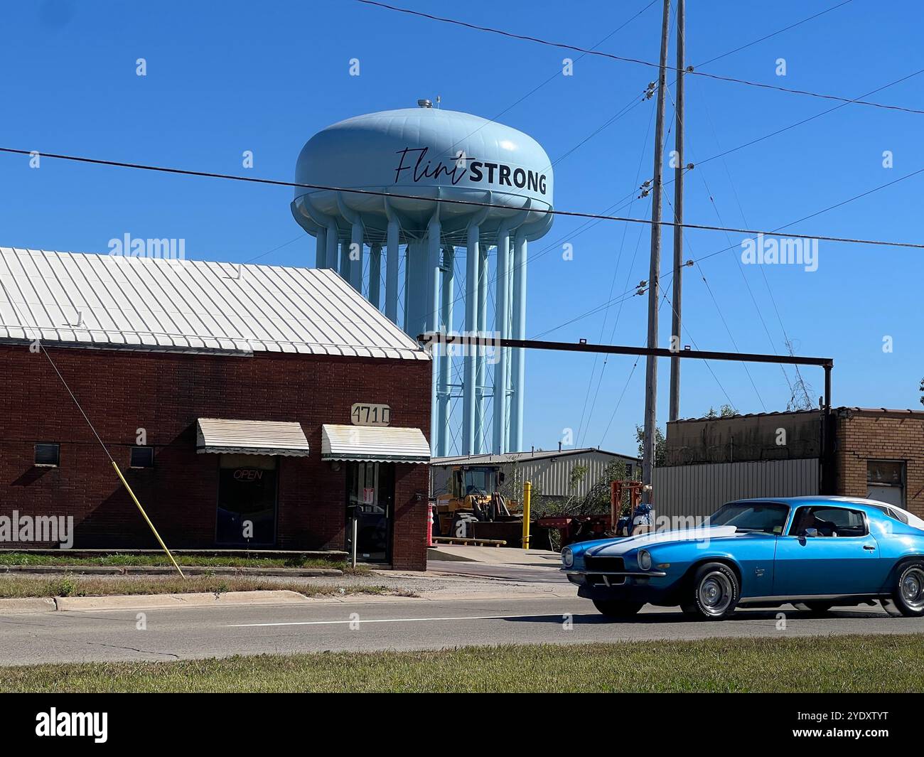 Flint, USA. 07th Oct, 2024. A car drives past the city's new water ...