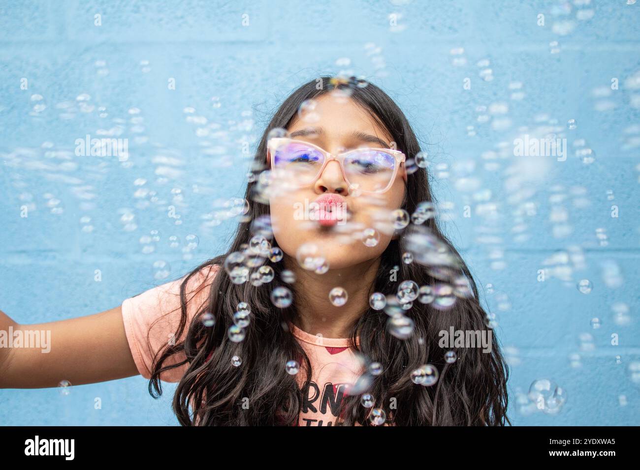 Girl blowing bubbles in water hi-res stock photography and images - Alamy