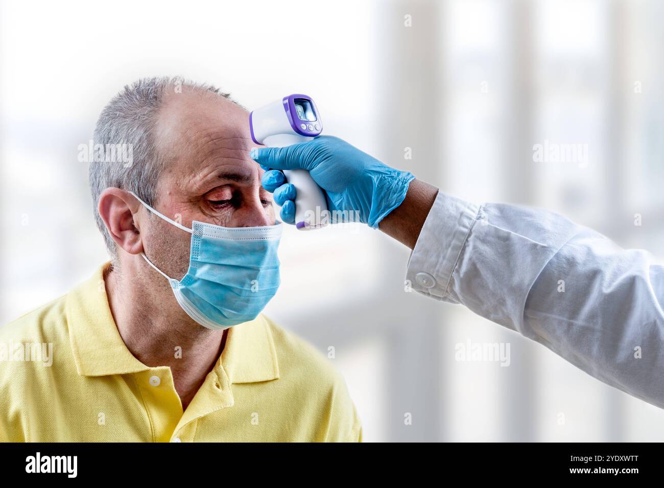 Taking a man s temperature with a digital thermometer. Temperature ...