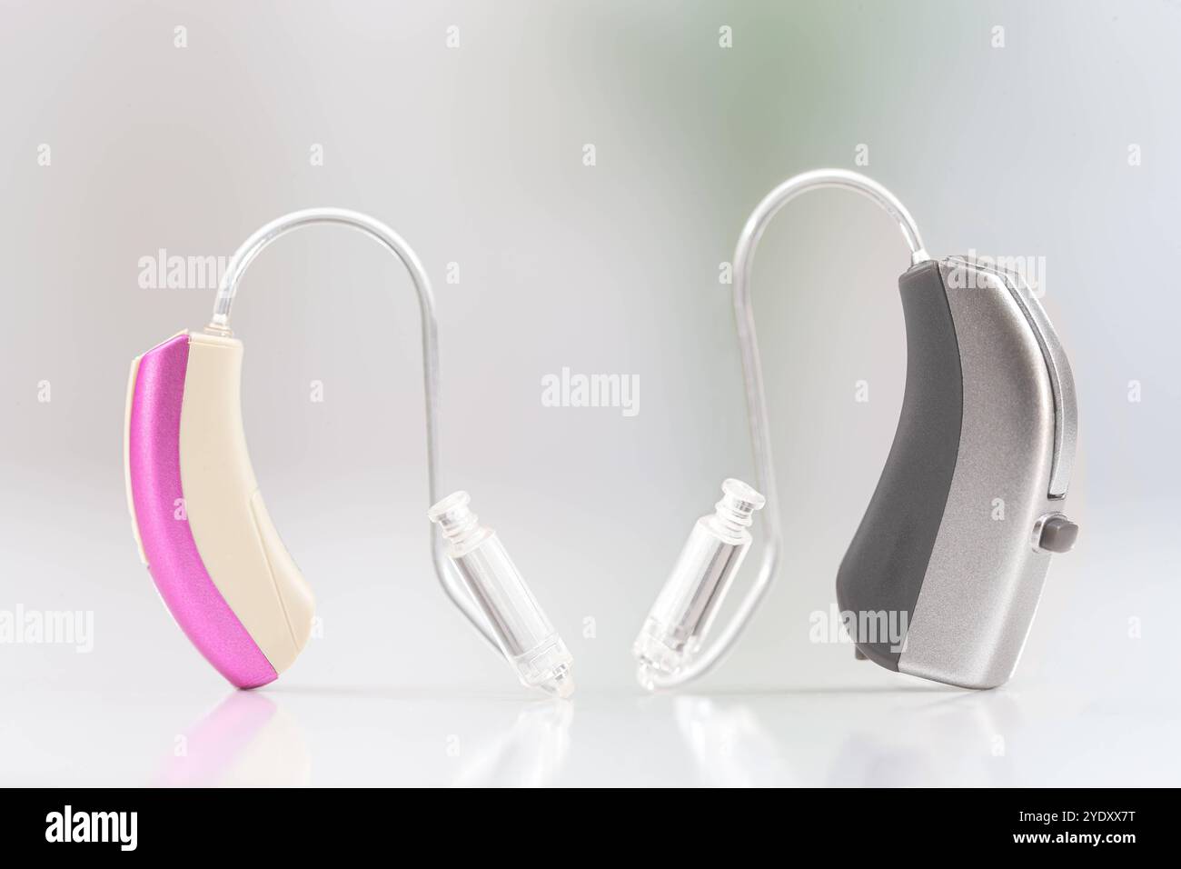 Hearing aids close-up on a light background. Hearing aids-behind-the ...