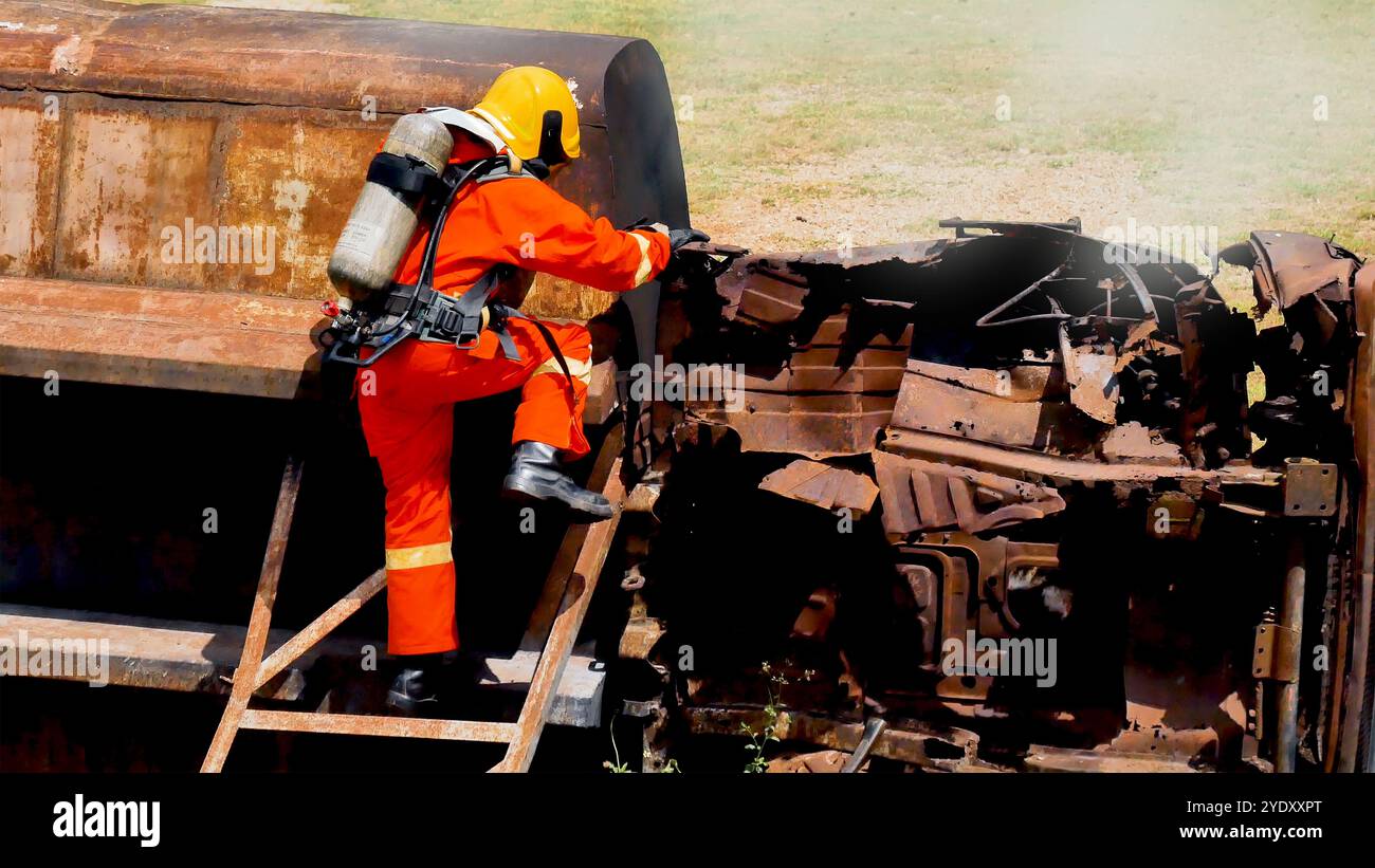 Firefighter fighting with flame using fire hose chemical water foam ...