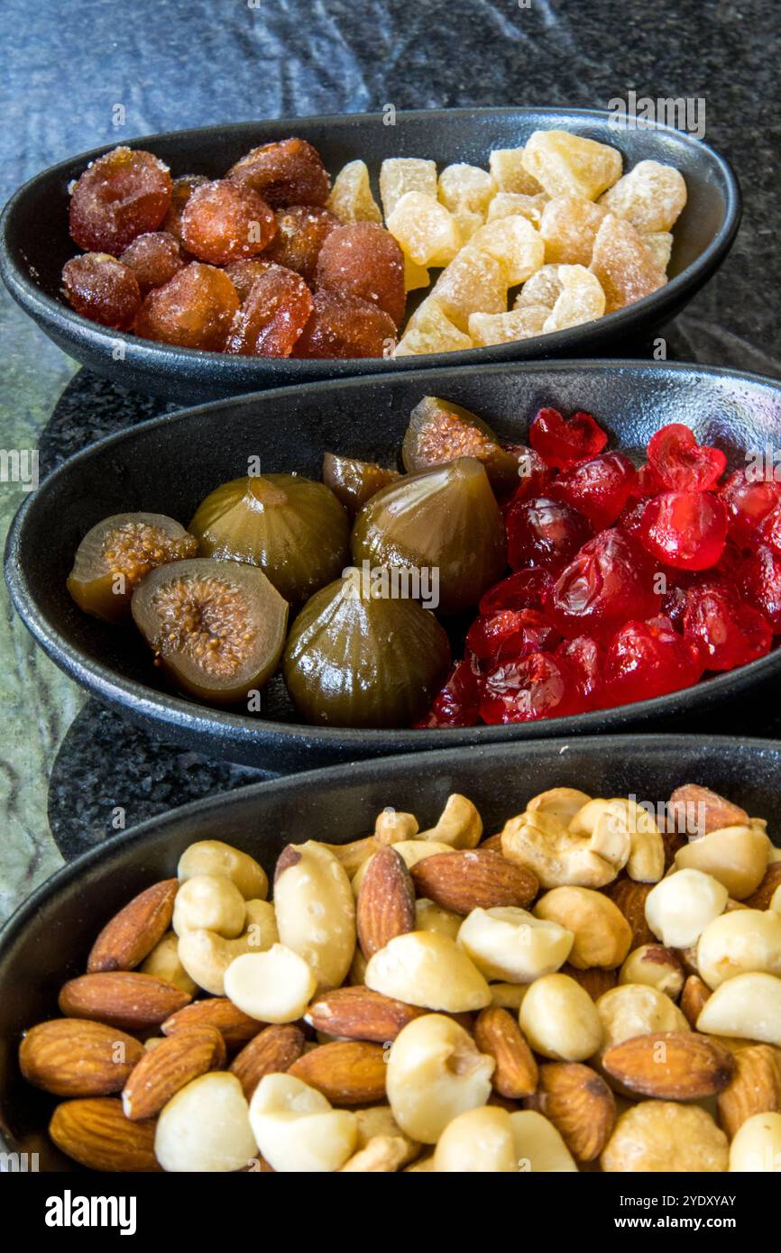 Black desert bowls filled with various different types of preserved ...