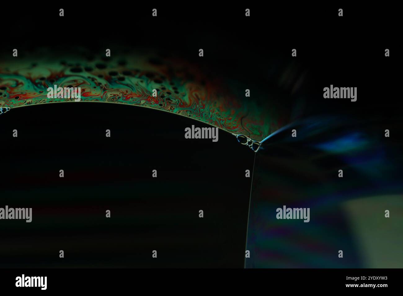 Green liquid phenomenal structure , green oils on a dark background ...