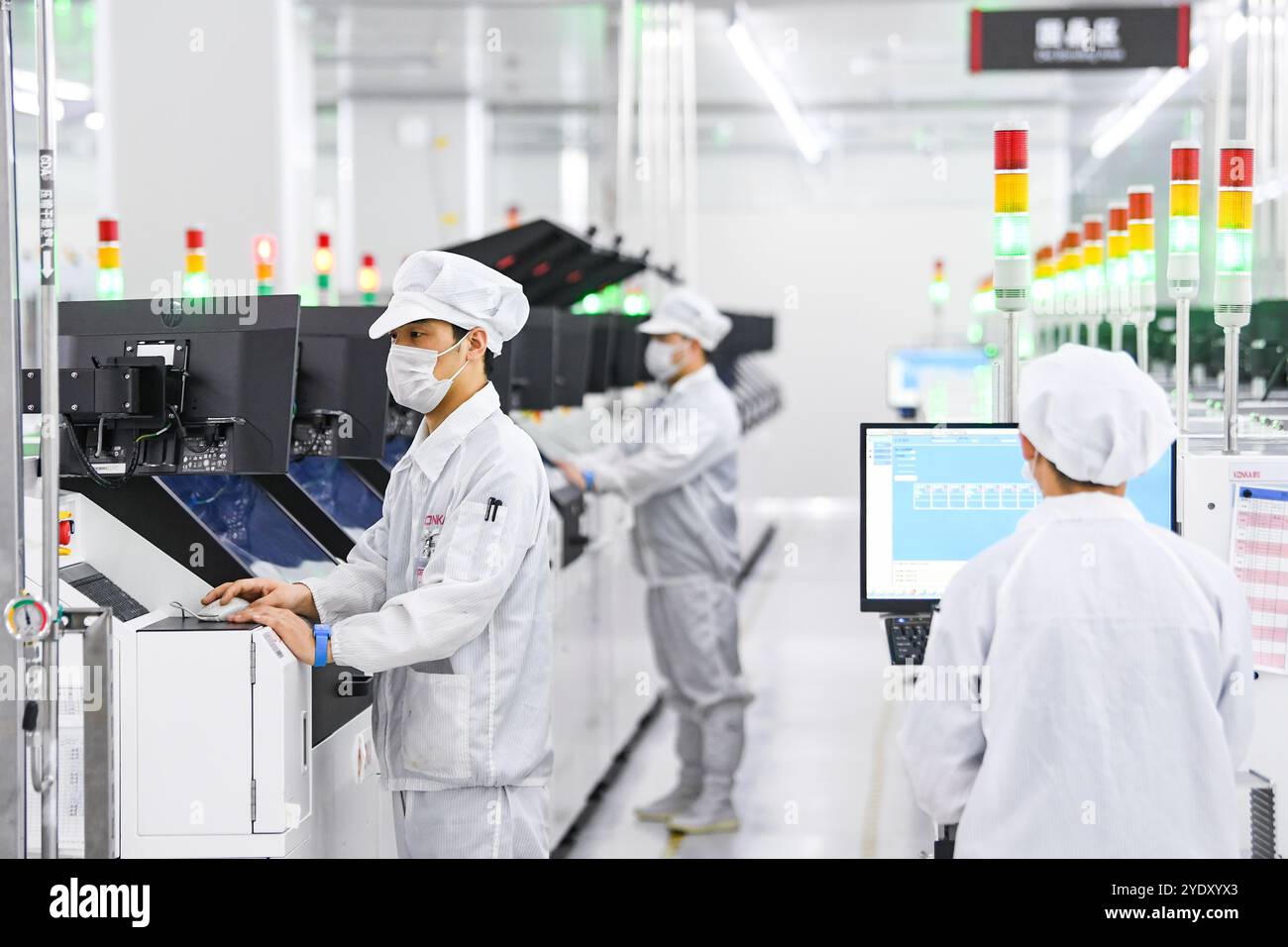 Beijing, China. 20th Sep, 2024. Staff members work at a display factory ...