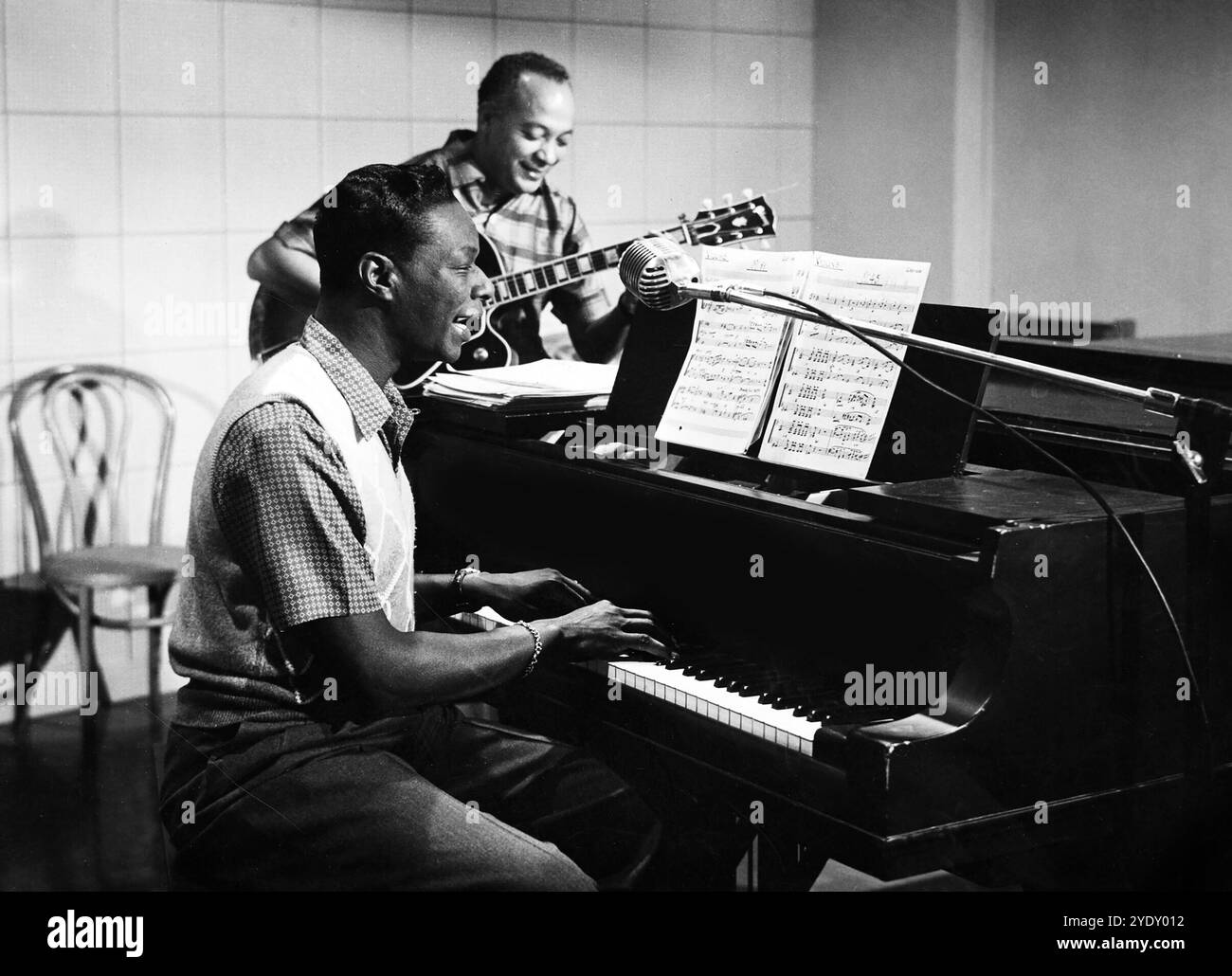 The Nat 'King' Cole Musical Story. Nat playing piano, Oscar Moore on ...