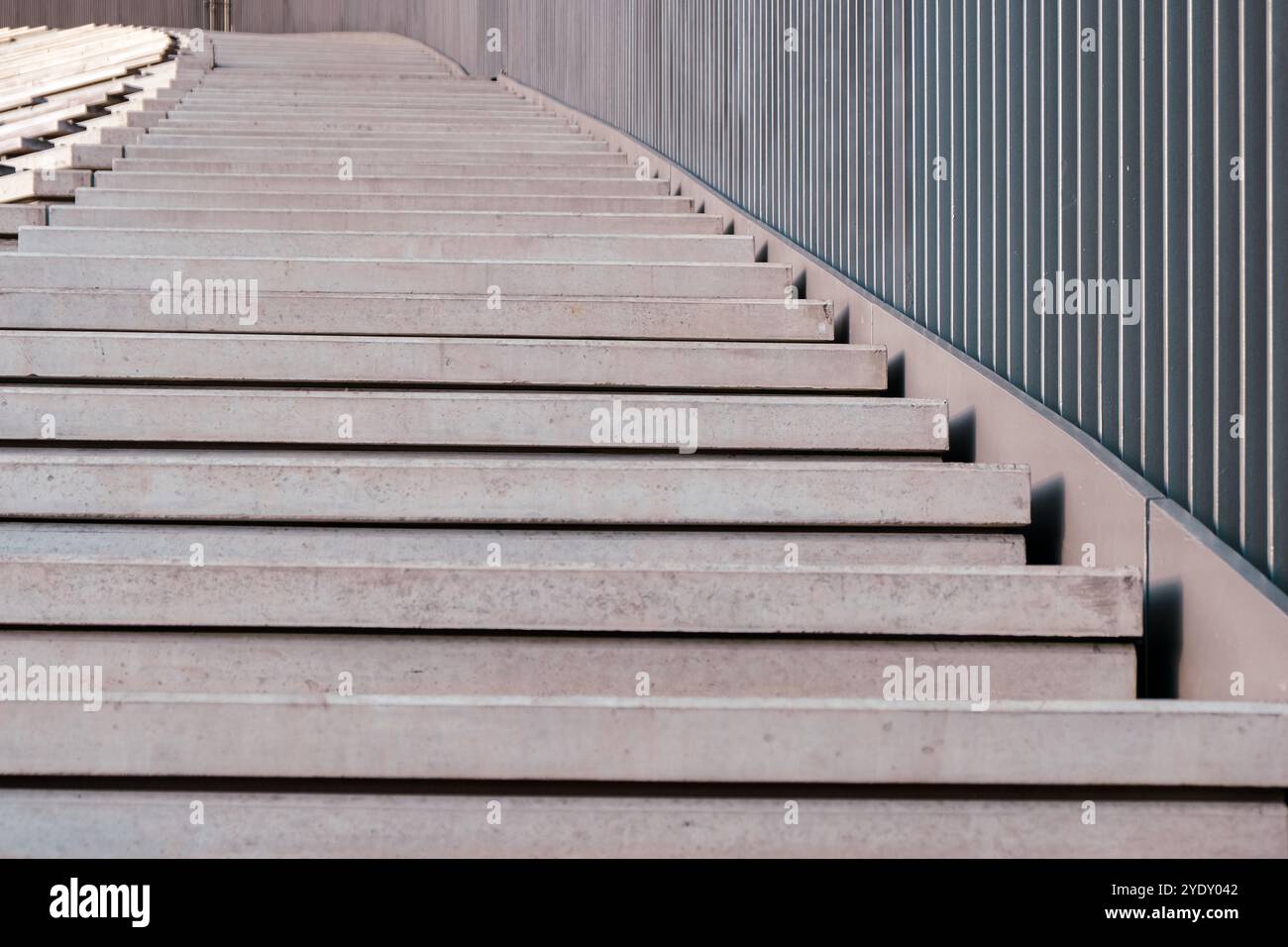 The structure features a series of concrete steps that ascend towards a ...