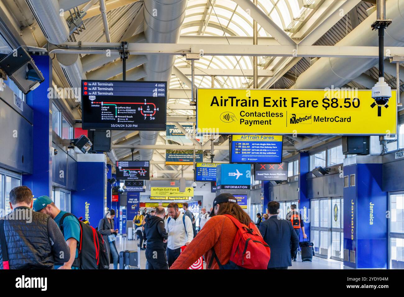 passengers Travelers wait for JFK AirTrain station serving airport ...