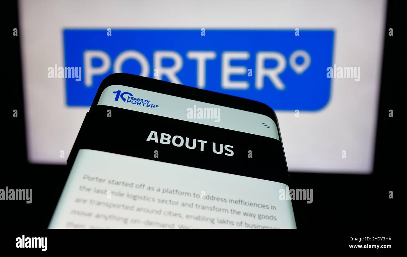 Mobile phone with website of Indian logistics company Porter (Porter.in ...