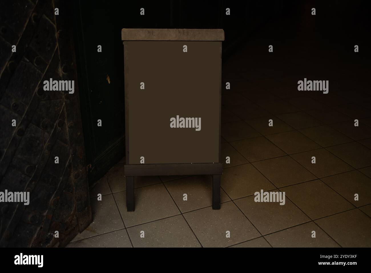 Black blank sheet is placed on located in front of a coffee shop. Blank ...