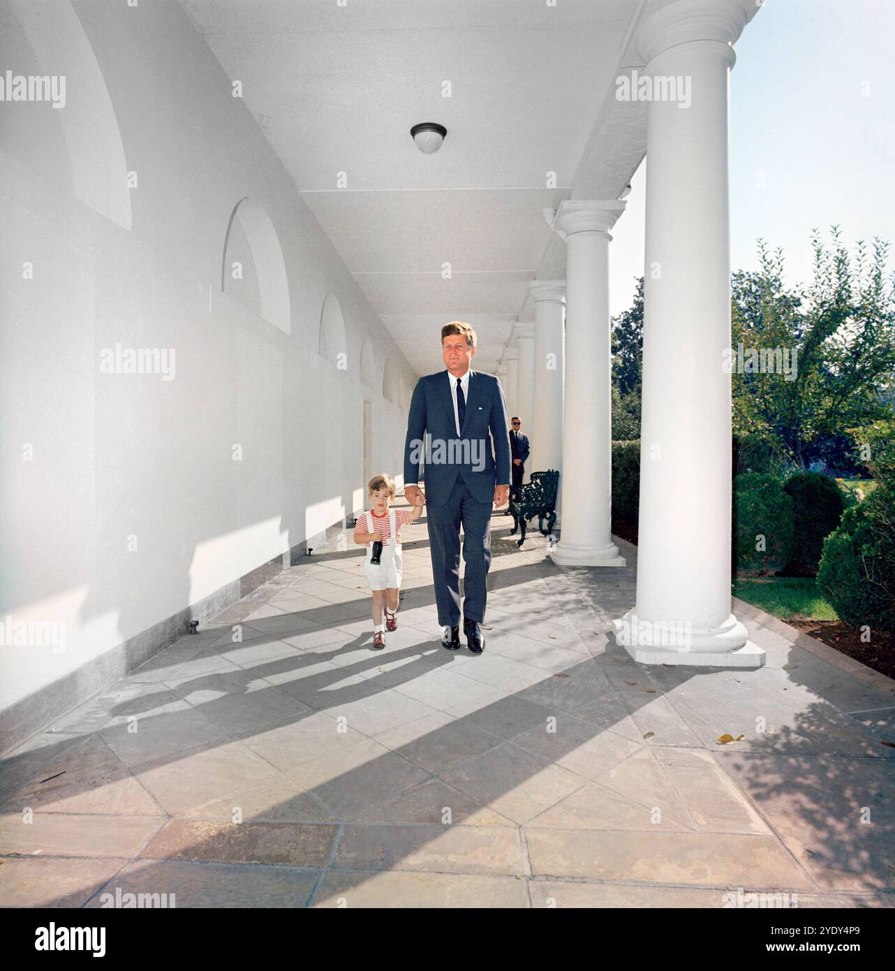 U.S. President John F. Kennedy walking with his son, John F. Kennedy ...