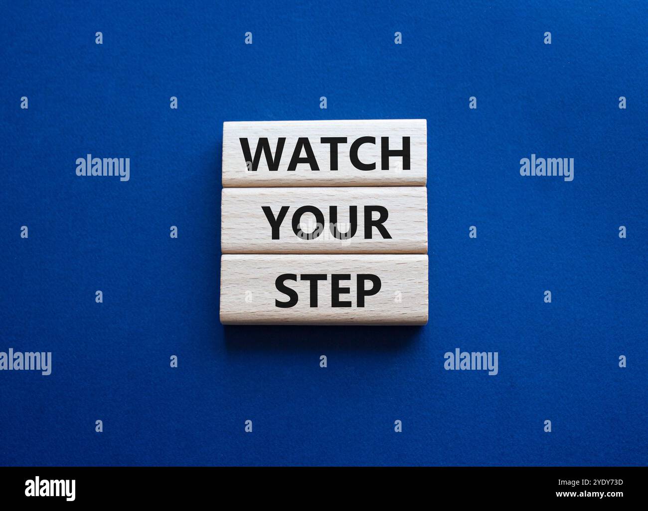 Watch your Step symbol. Concept words Watch your Step on wooden blocks ...