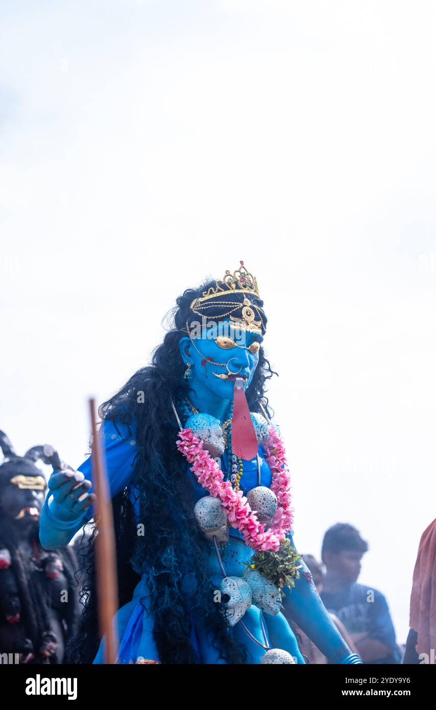 Kulasai Dasara, Portrait of indian hindu devotee with painted face and ...