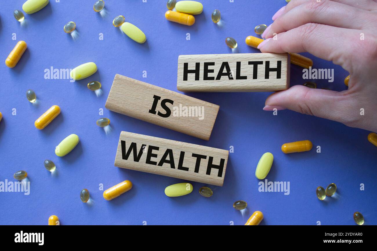 Health is Wealth symbol. Concept word Health is Wealth on wooden blocks ...