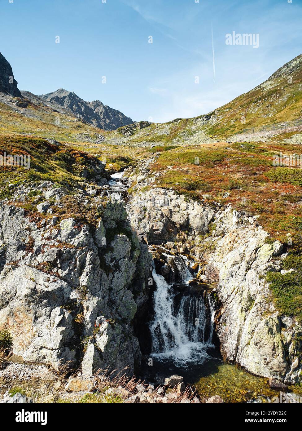 Mountain stream in alpine valley. Waterfall near Flüela mountain Pass ...