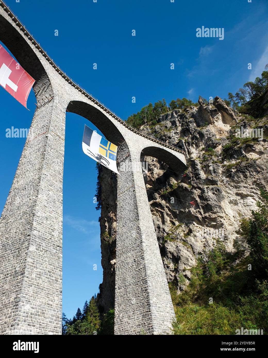 Looking up at Landwasserviadukt. Curved railway viaduct in Abula alps ...
