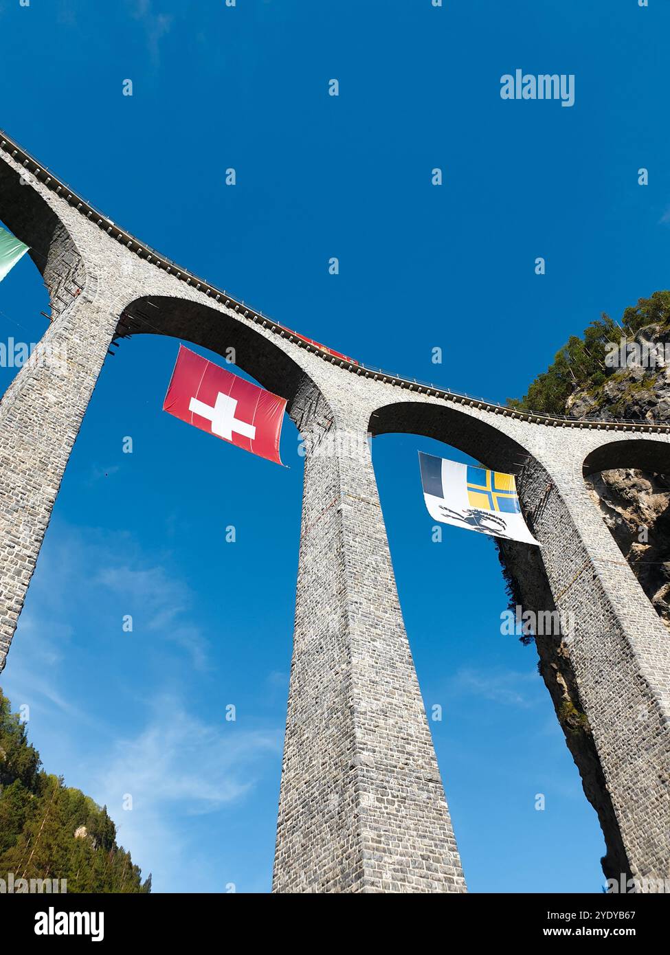 Looking up at Landwasserviadukt. Curved railway viaduct in Abula alps ...