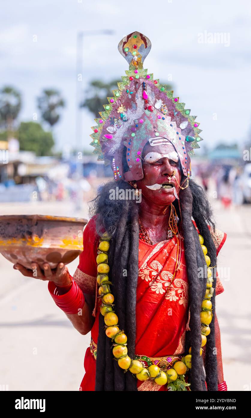 Kulasai Dasara, Portrait of indian hindu devotee with painted face and ...