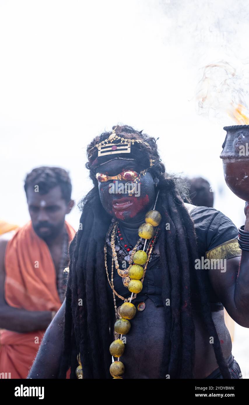 Kulasai Dasara, Portrait of indian hindu devotee with painted face and ...