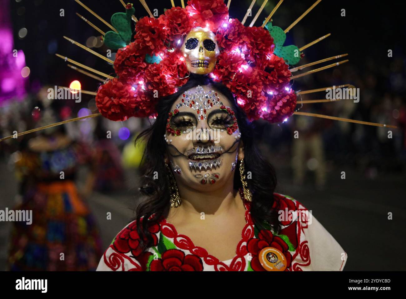 Non Exclusive: A Person dressed up as catrina and with her face made up ...