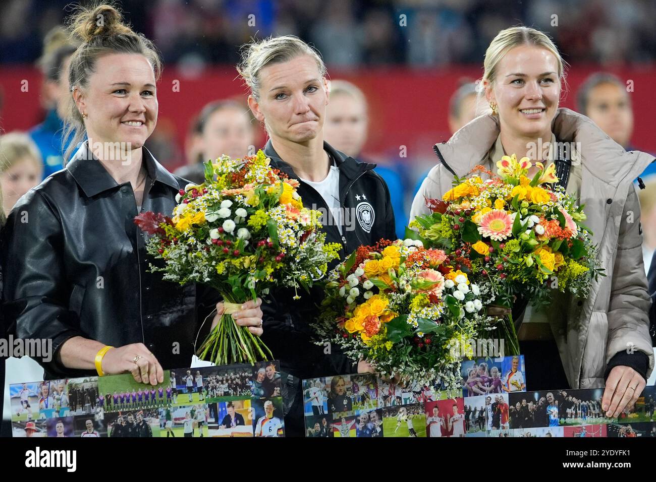 Germany's Merle Frohms, Alexandra Popp and Marina Hegering, from right ...